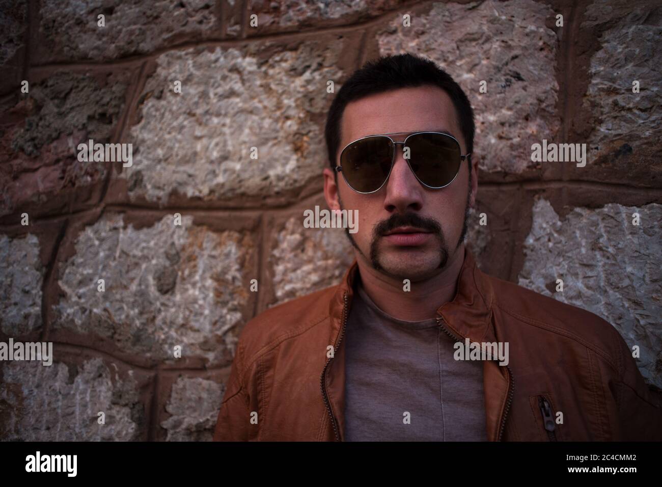 lifestyle young man with mustache, car, rock n roll Stock Photo - Alamy