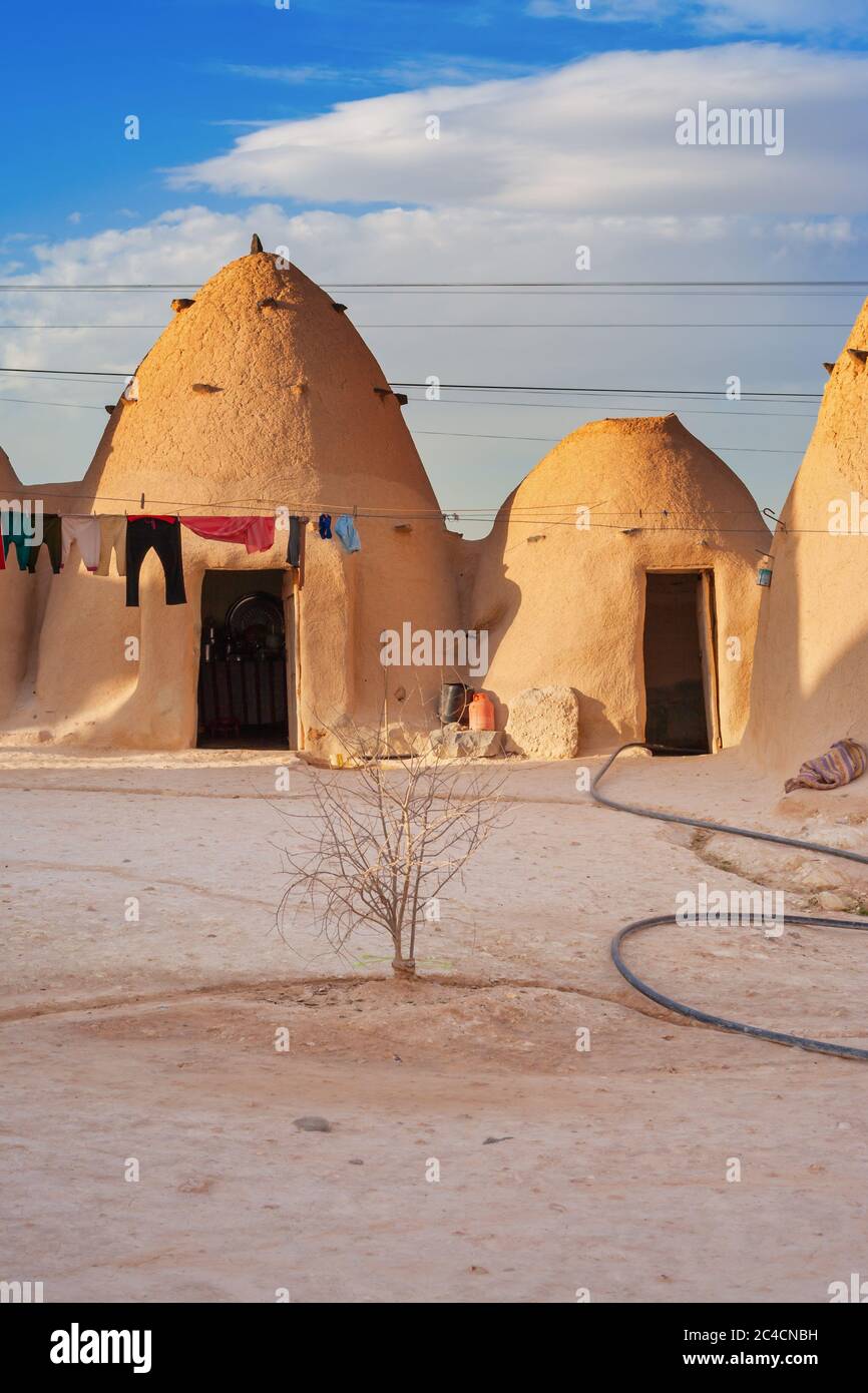 Village with traditional beehive house built of brick and mud, Srouj ...