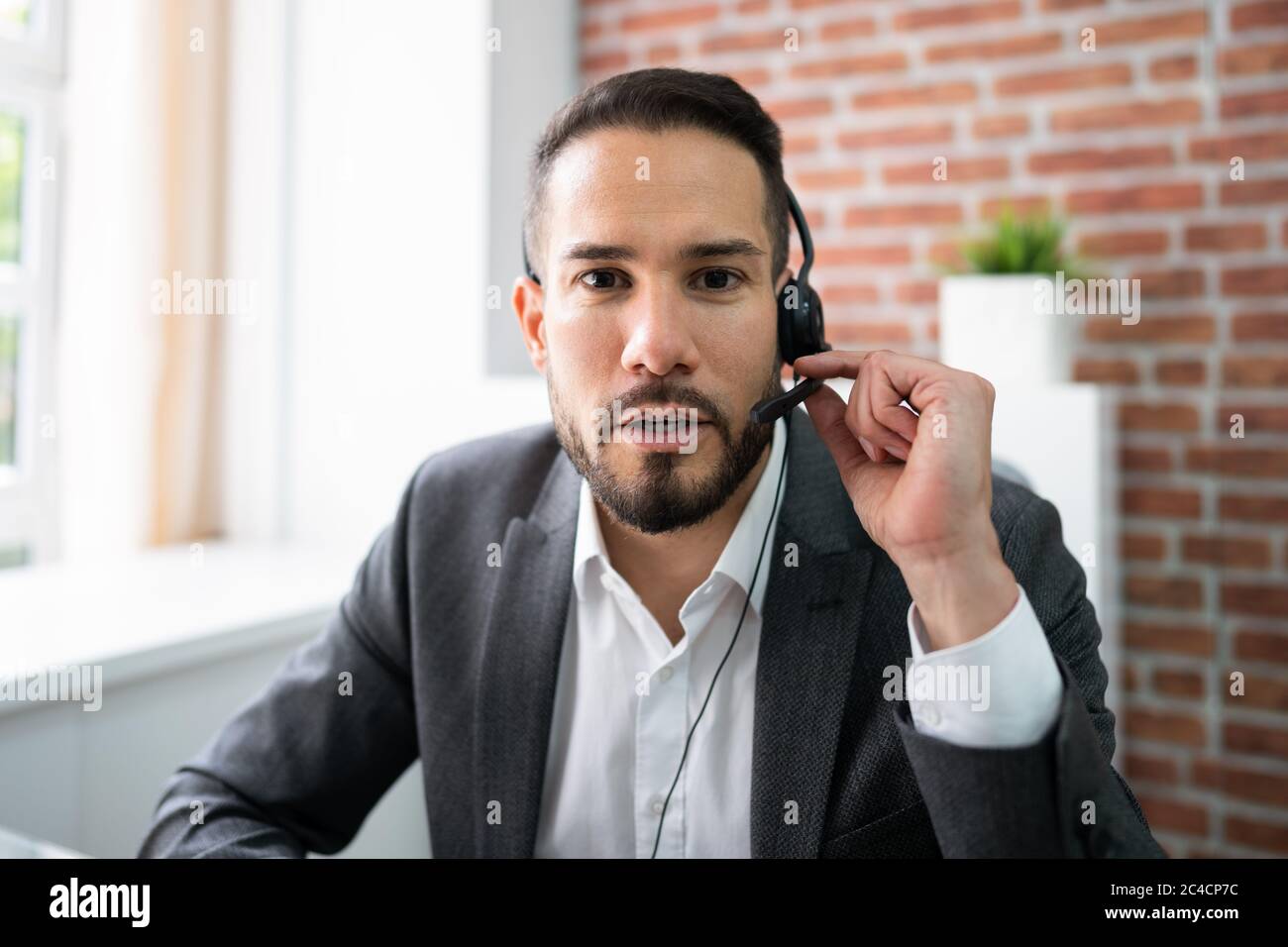 Customer Service Agent Man In Call Center Stock Photo - Alamy