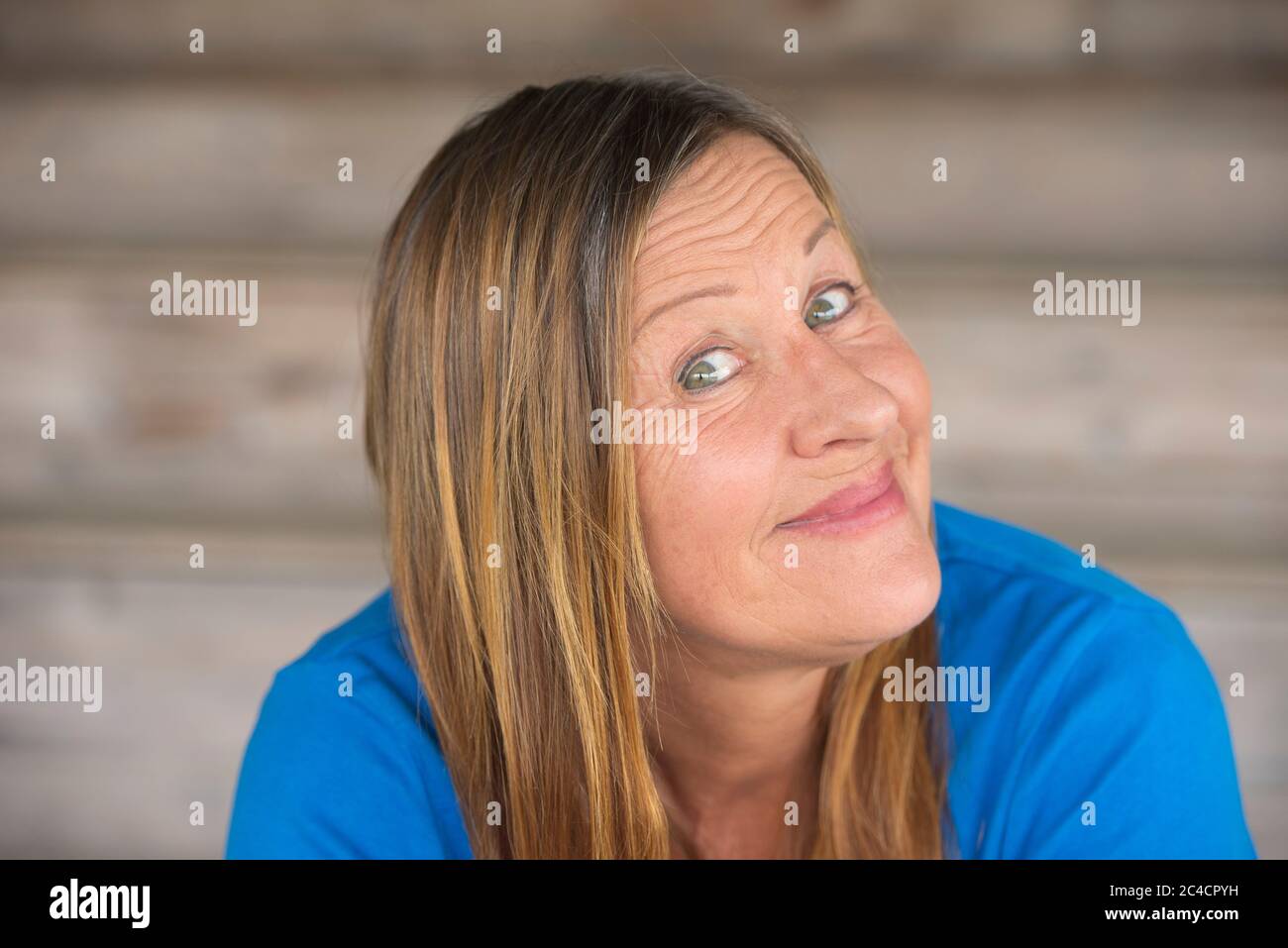 Portrait attractive mature woman with happy relaxed cheeky confident ...