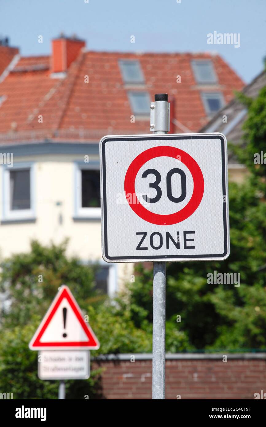 Traffic sign Tempo 30 Zone, Modern, monotonous residential buildings ...