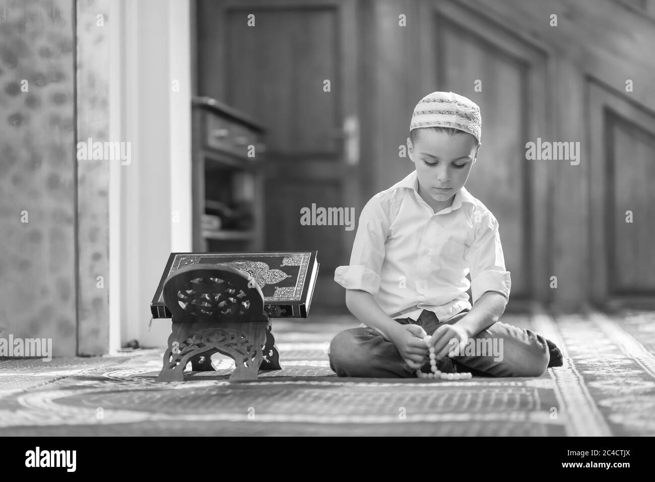 boy prays in the mosque during the month of Ramadan Stock Photo - Alamy