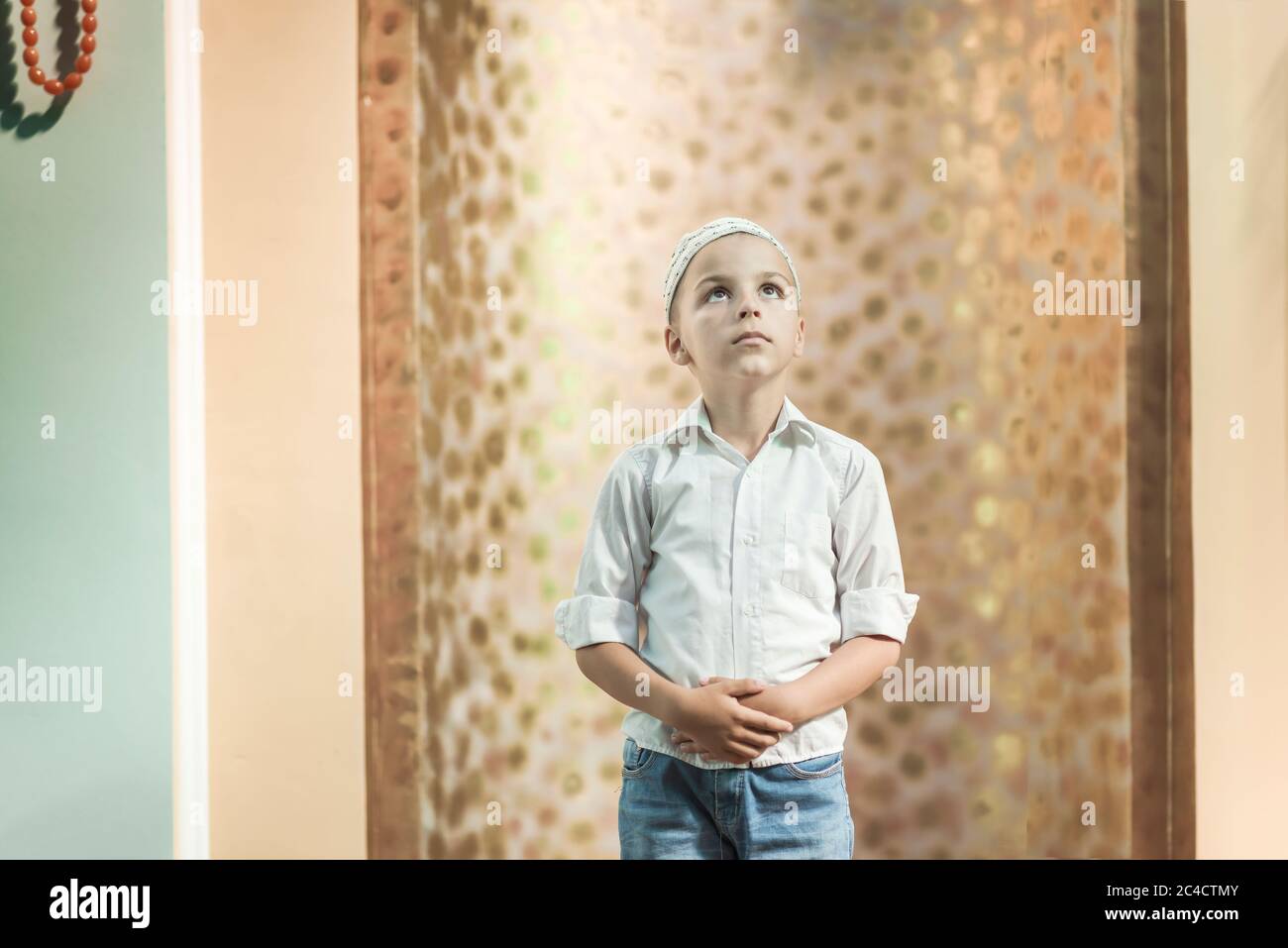 boy prays in the mosque during the month of Ramadan Stock Photo - Alamy