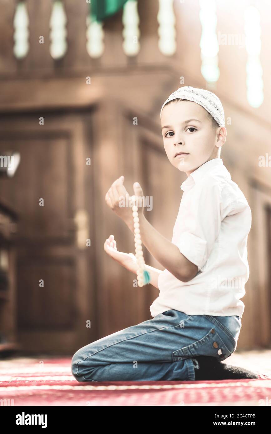 boy prays in the mosque during the month of Ramadan Stock Photo - Alamy