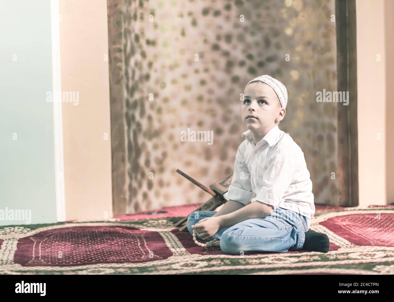 boy prays in the mosque during the month of Ramadan Stock Photo - Alamy