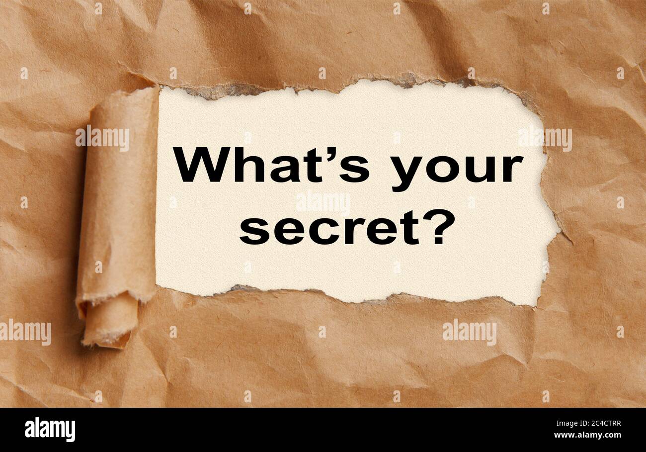 Text Whats your secret appearing behind torn brown paper Stock Photo ...