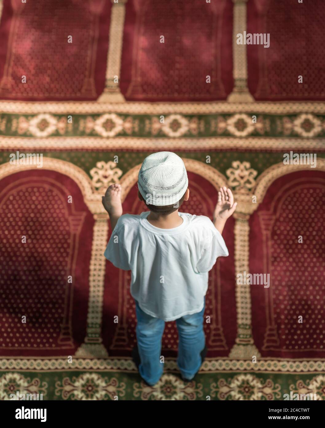 boy prays in the mosque during the month of Ramadan Stock Photo - Alamy