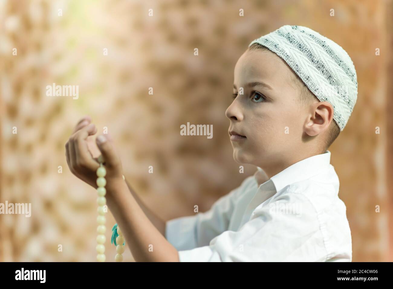 boy prays in the mosque during the month of Ramadan Stock Photo - Alamy