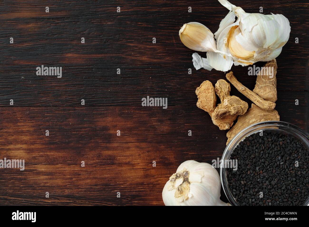 Spices on dark wooden background, view from above Stock Photo - Alamy