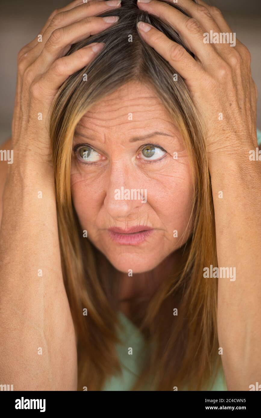 Portrait attractive mature woman, stressed, anxious, scared, unhappy ...