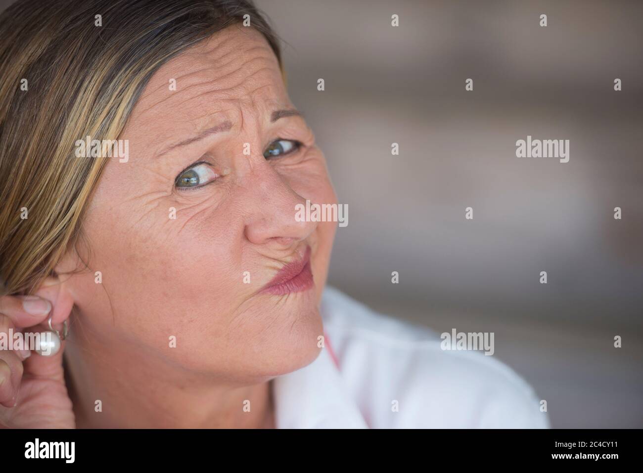 Portrait elegant attractive mature woman with concerned worried ...
