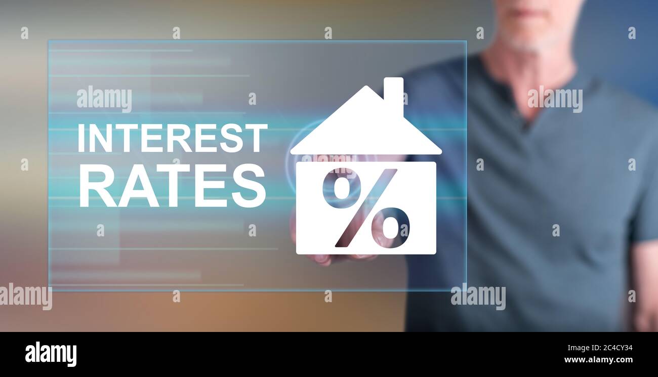 Man touching an interest rates concept on a touch screen with his ...