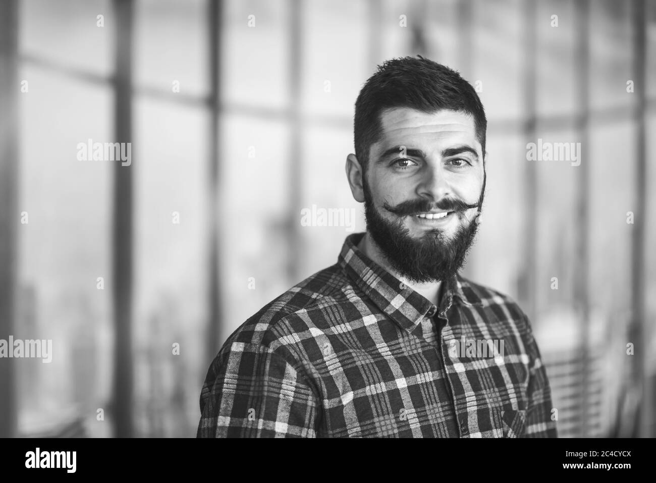 Serious attractive young bearded man Black and White Stock Photos ...