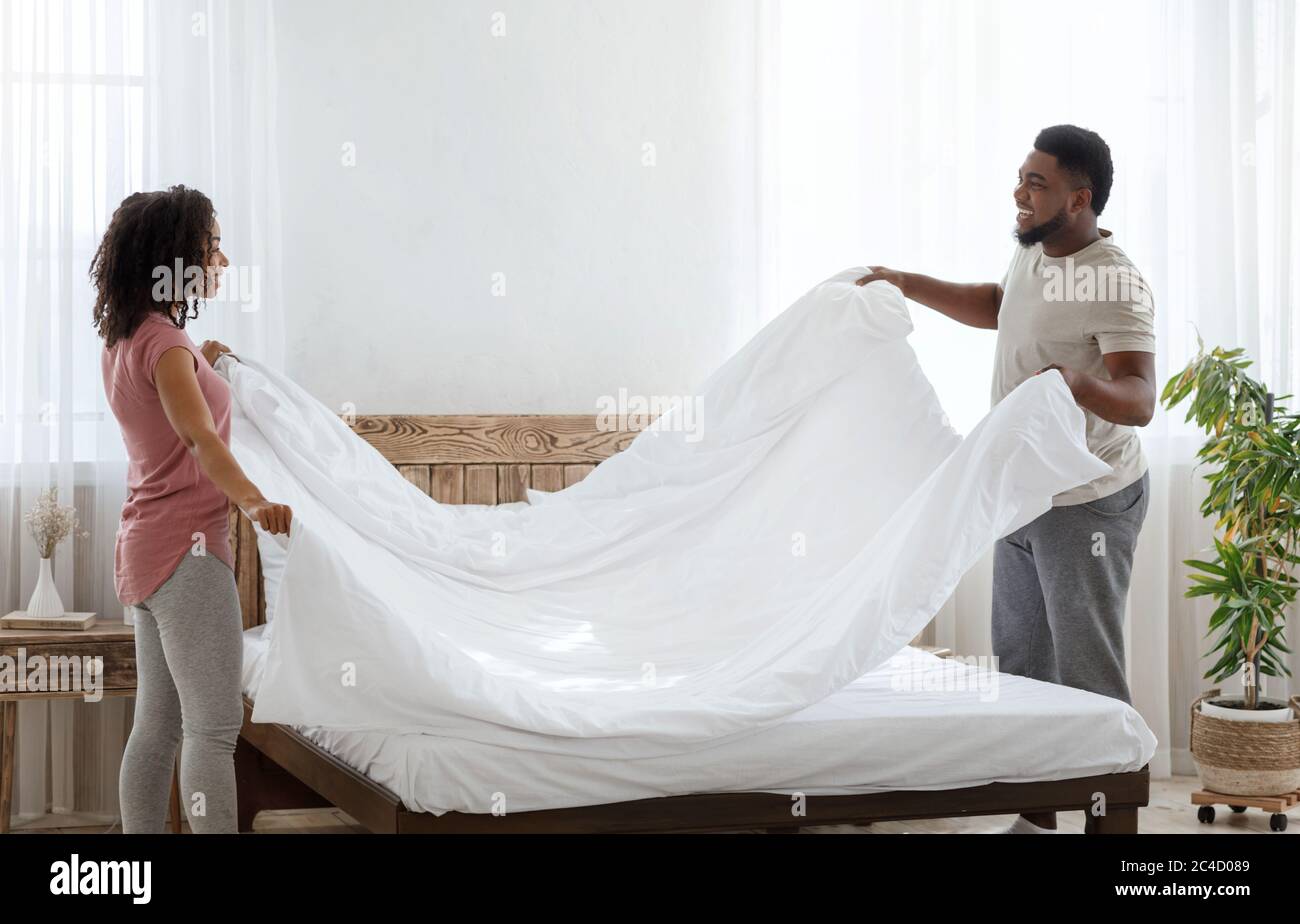 Young couple making love bed hi-res stock photography and images - Alamy