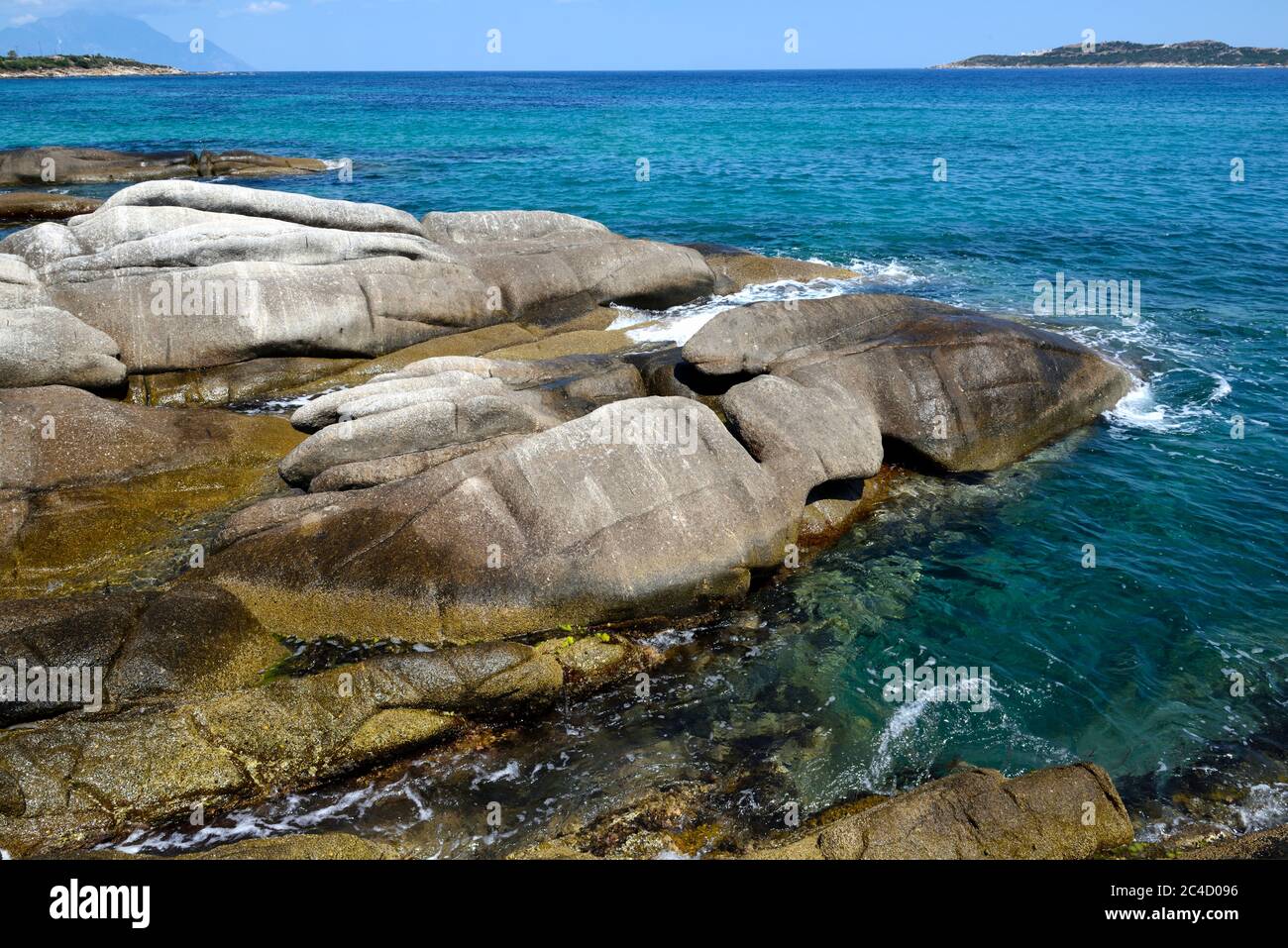 Beautiful seascape with stones and translucent blue water Stock Photo ...