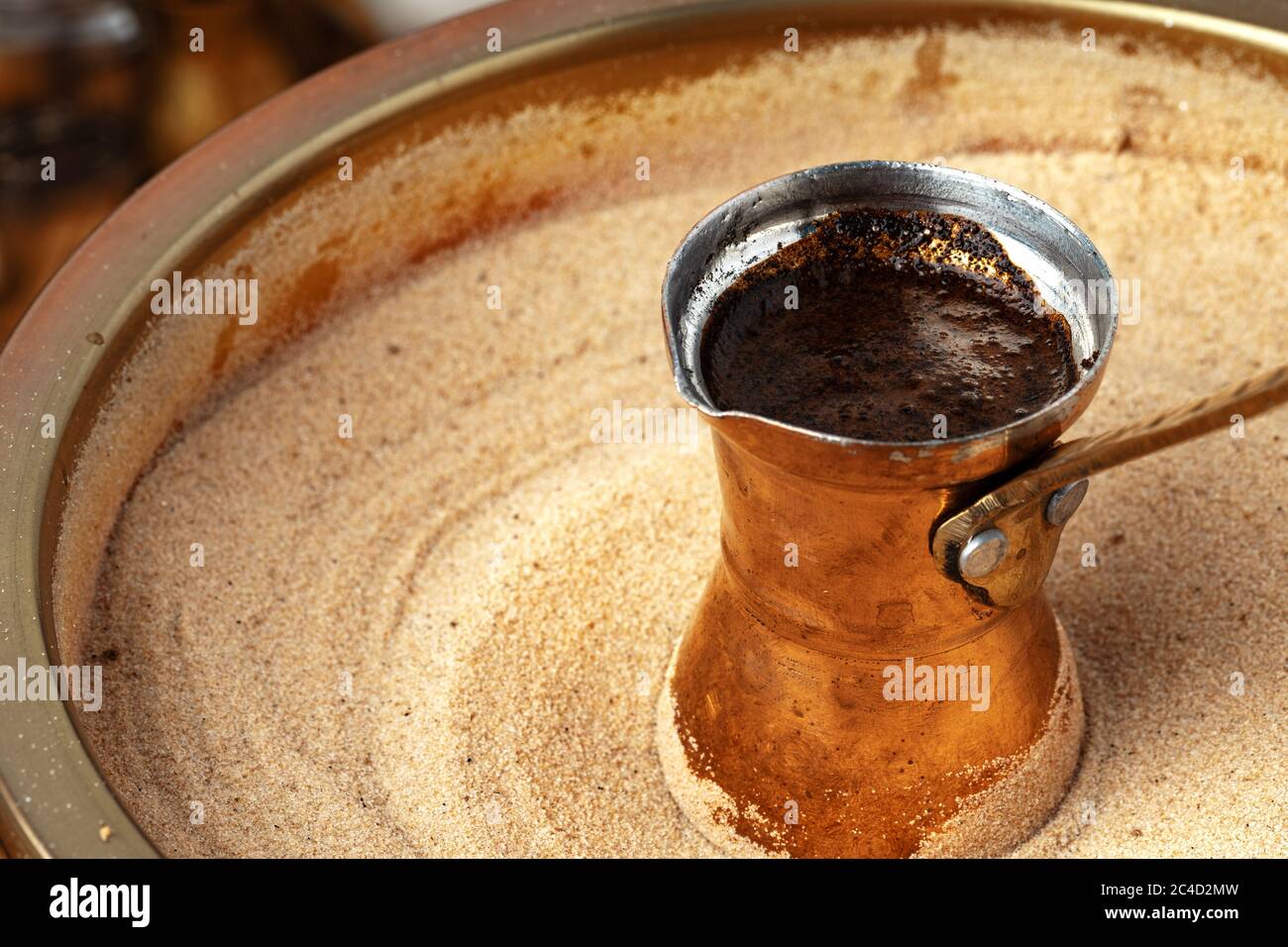 Turkish coffee in cezve on the sand Stock Photo - Alamy