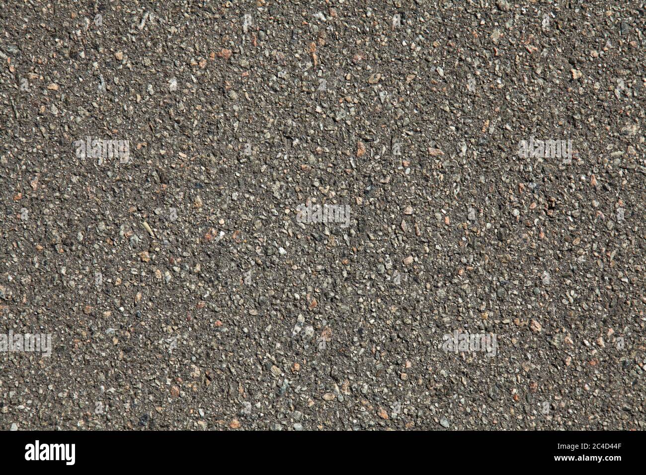 An old asphalt surface, background. Detailed texture of the bitumen ...