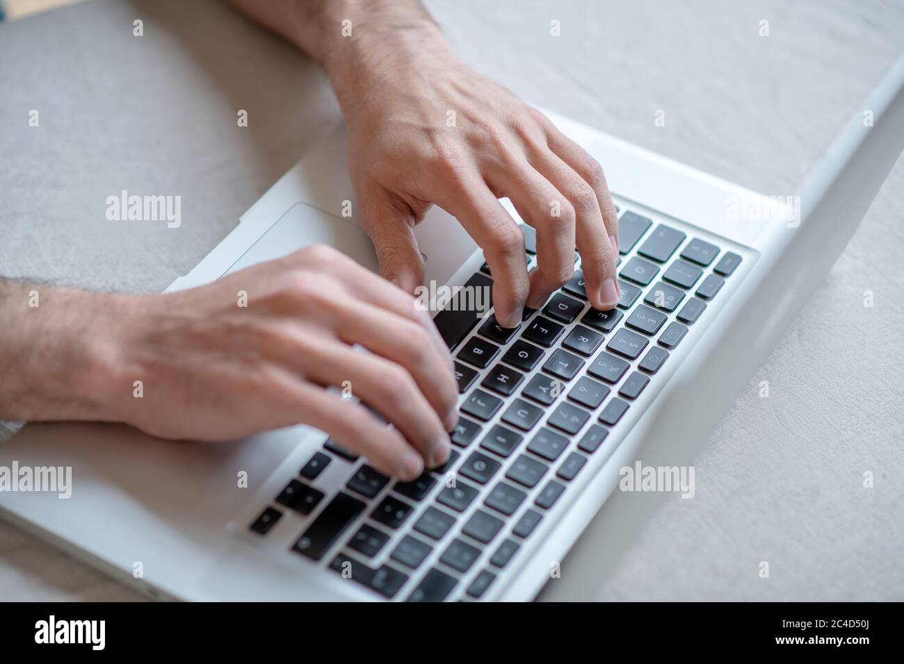 Close up picture of mans hands on the keyboard Stock Photo - Alamy