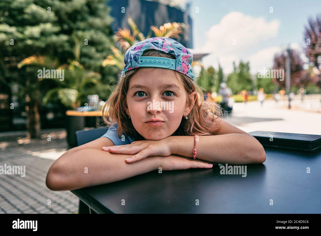 little girl with a cocktail at the table Stock Photo - Alamy