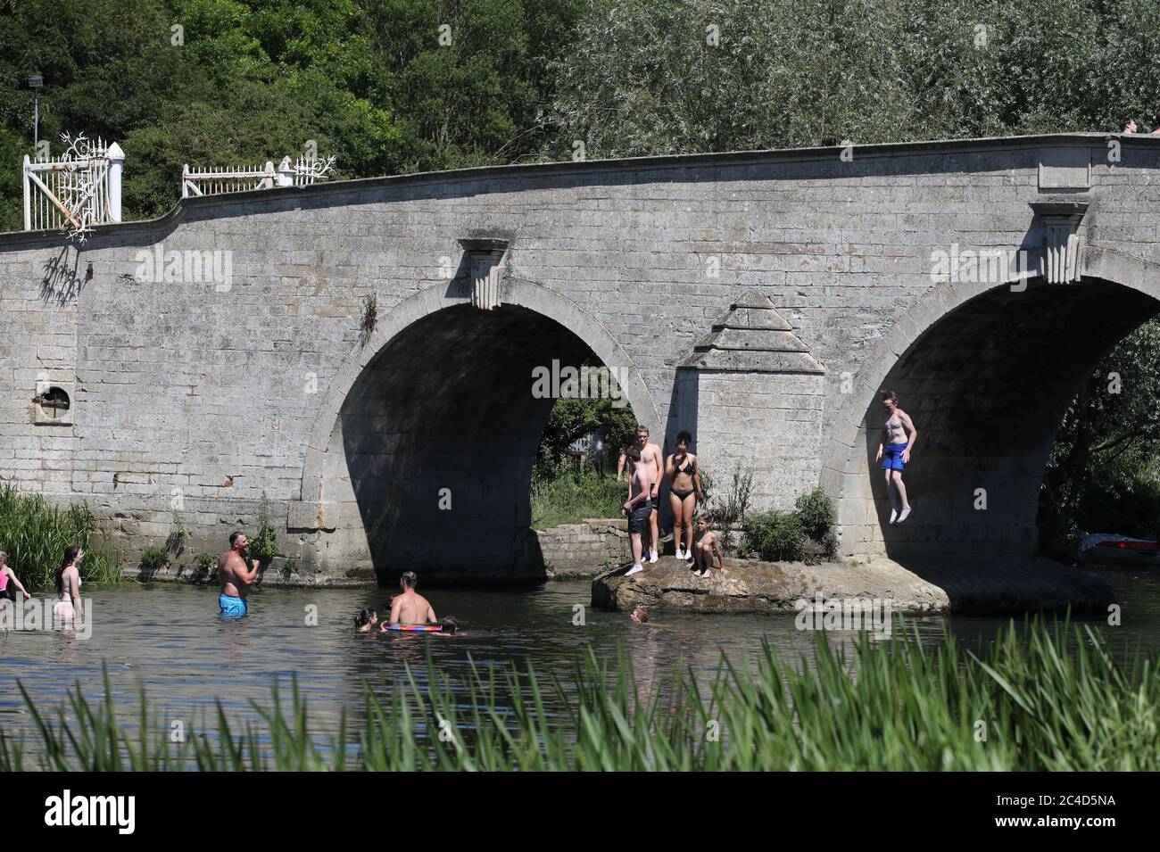 People enjoying a paddle in the River Nene at Milton Ferry Bridge ...