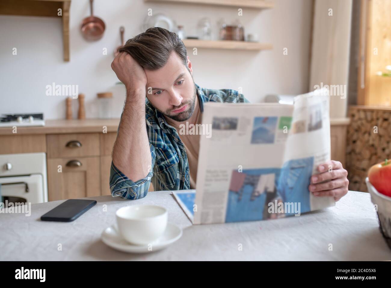 Disturbed man in table hi-res stock photography and images - Alamy