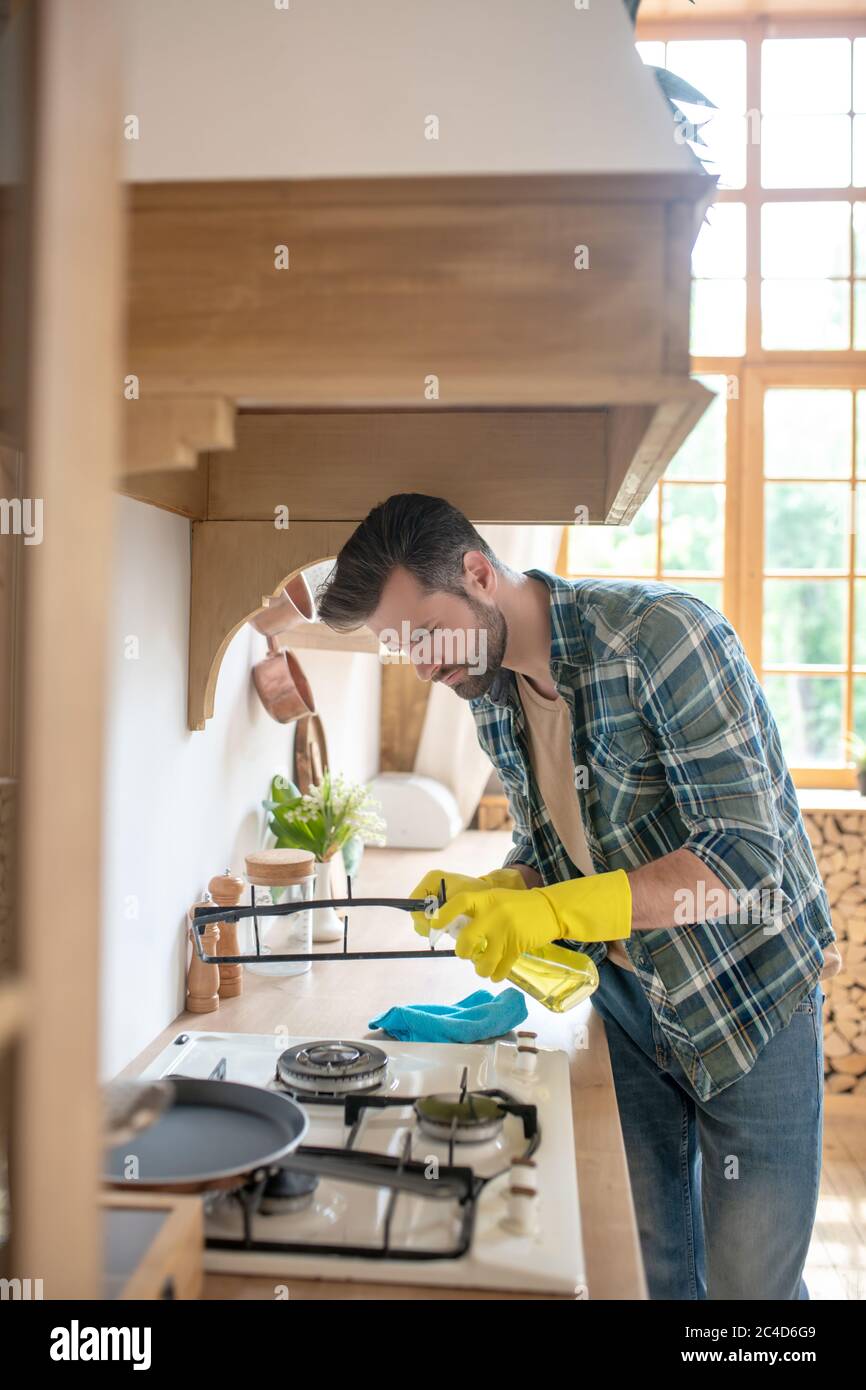 Man cleaning oven in kitchen hi-res stock photography and images - Alamy