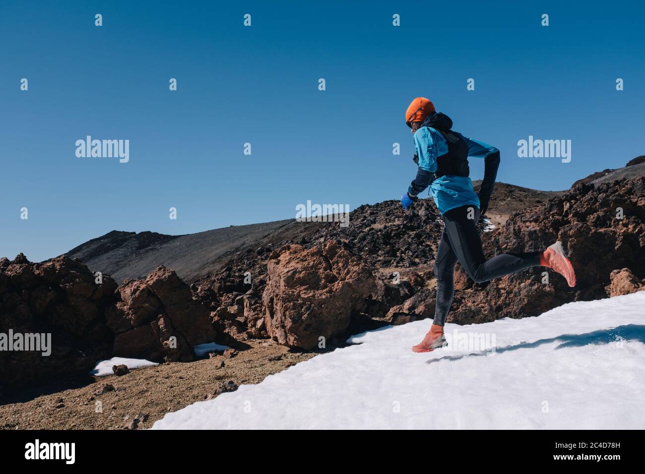 Trail running man runner in white winter mountains on snow Stock Photo ...