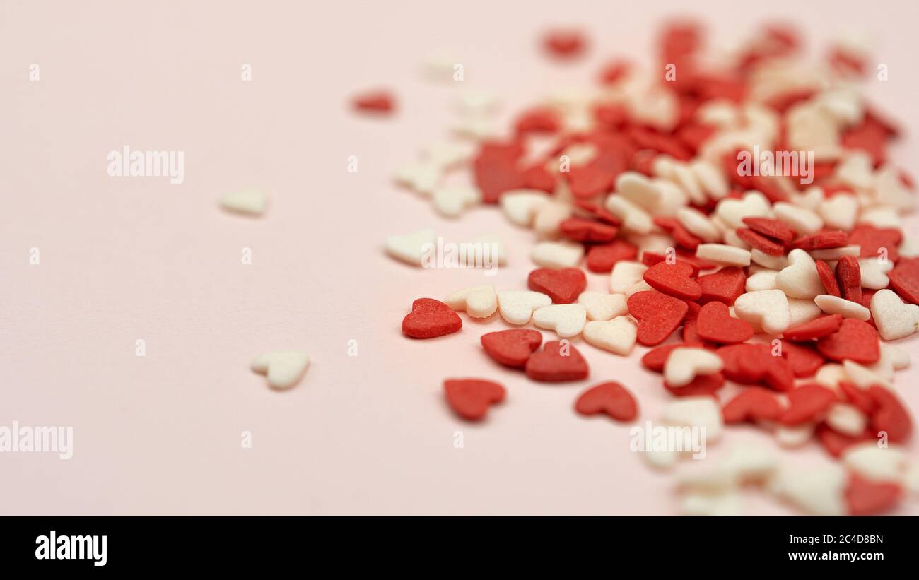 Small, sweet, red and white candy hearts Stock Photo - Alamy