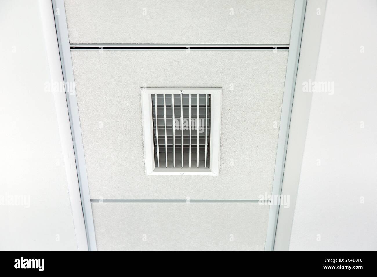 multi level white plasterboard ceiling and square tiled suspended ...