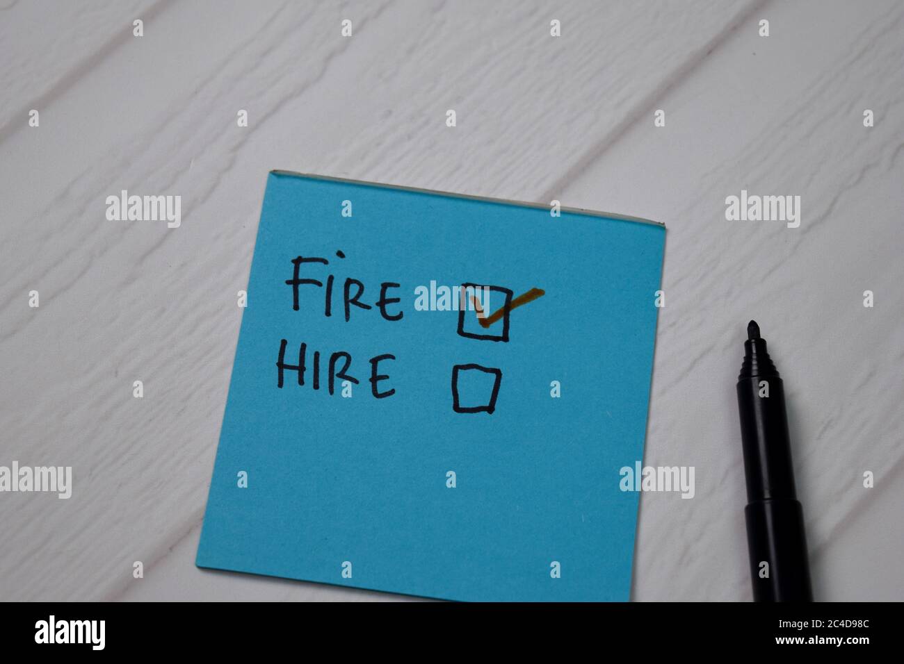 Fire and Hire write on a sticky note. Supported by an additional ...