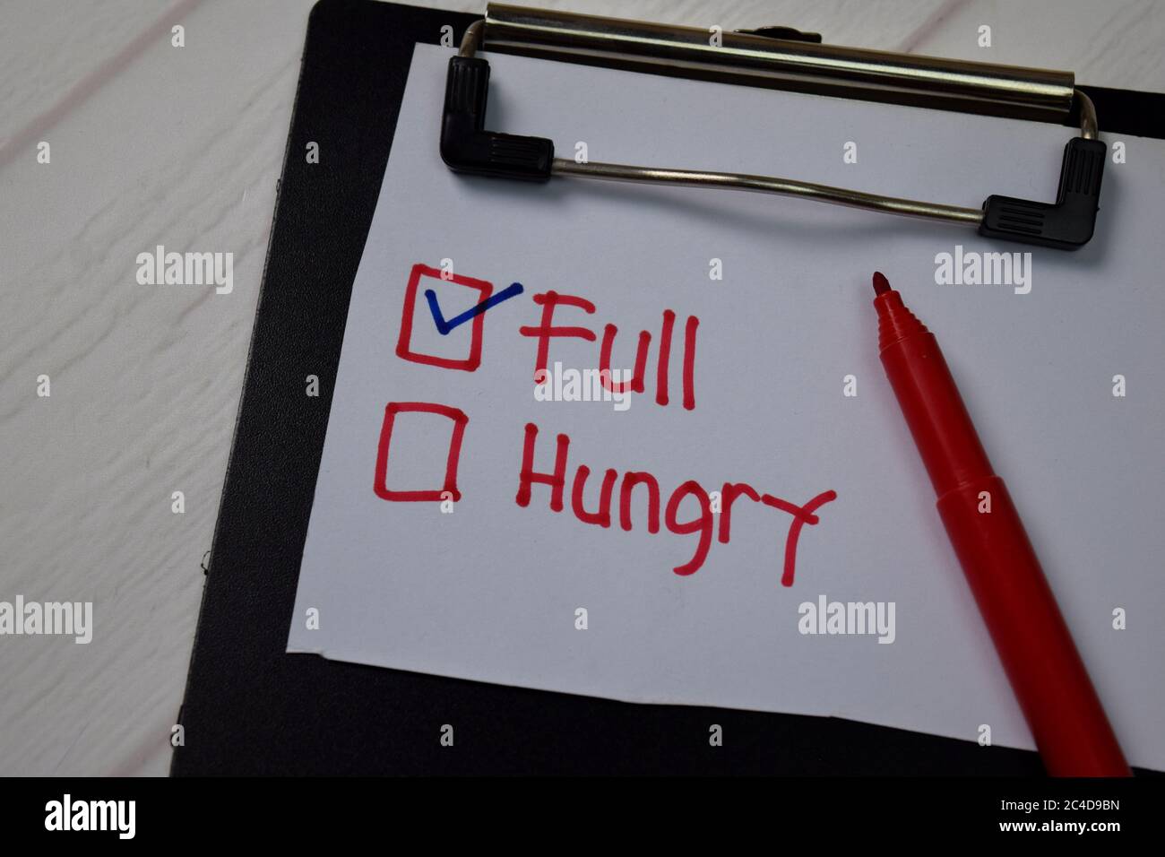 Full and Hungry write on a sticky note. Supported by an additional ...
