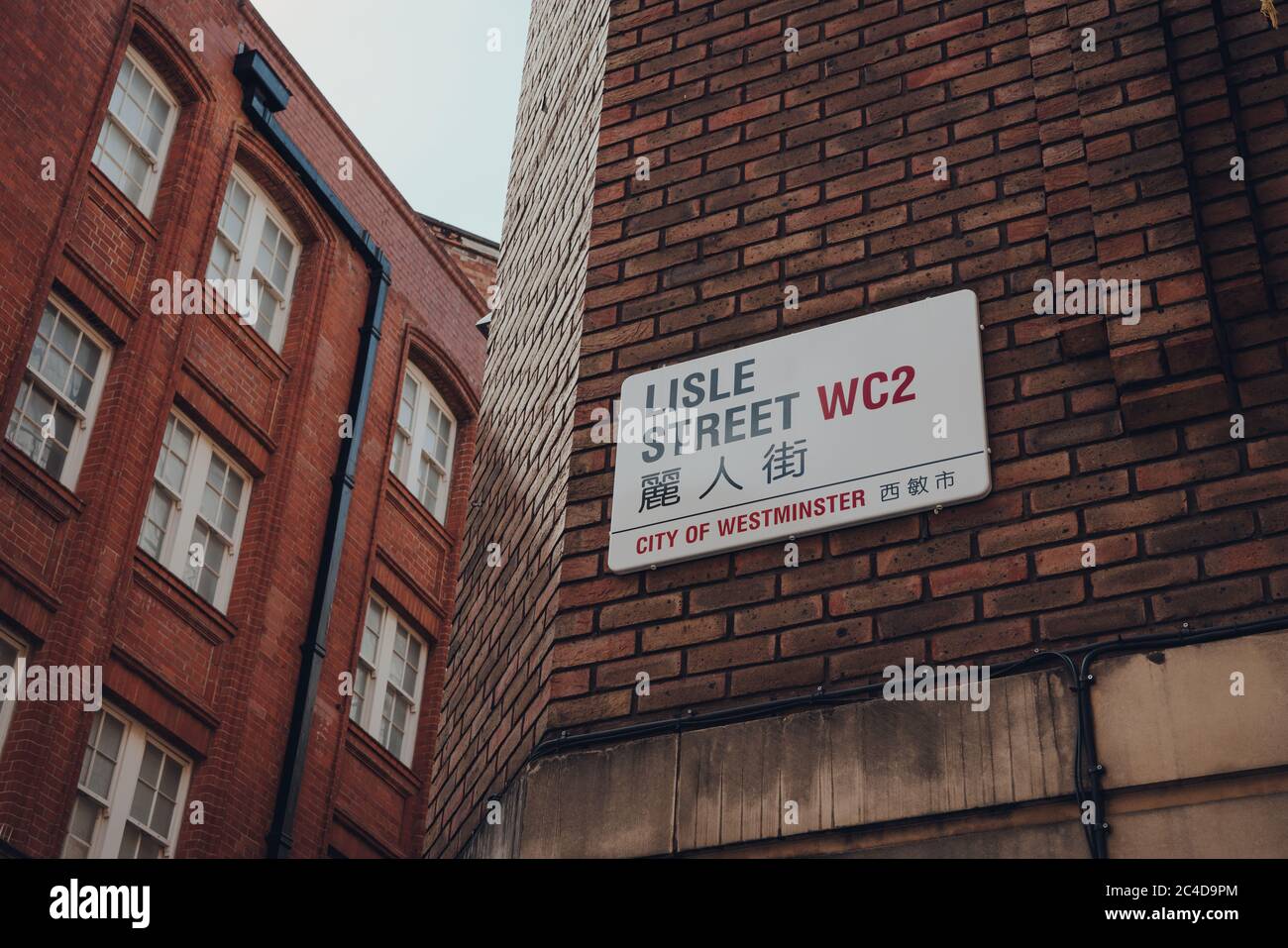 London, UK - June 13, 2019: Street name sign in English and Mandarin on ...