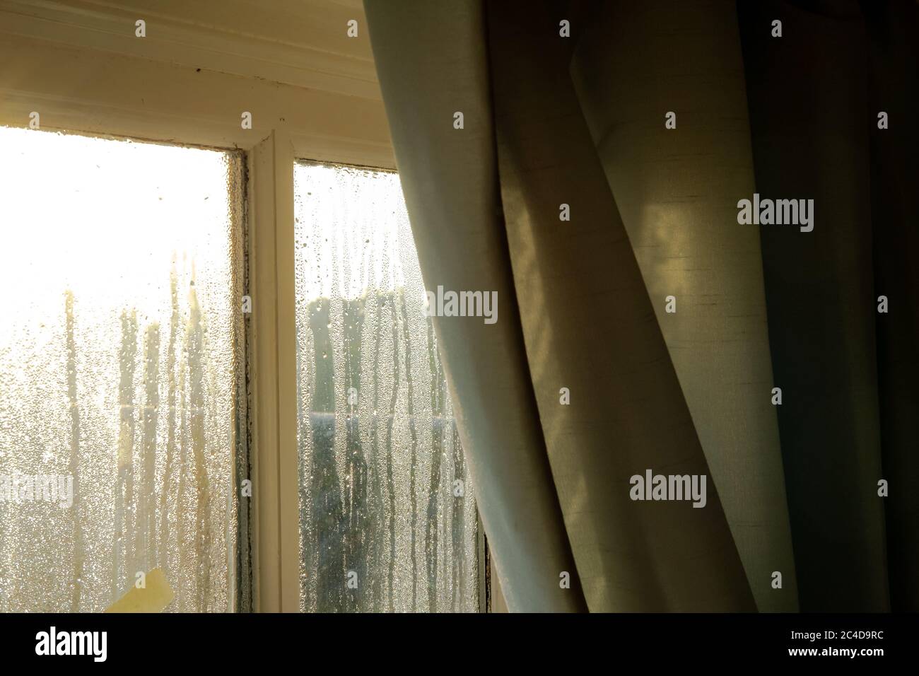 Interior of an old cottage, showing heavy water condensation on the ...