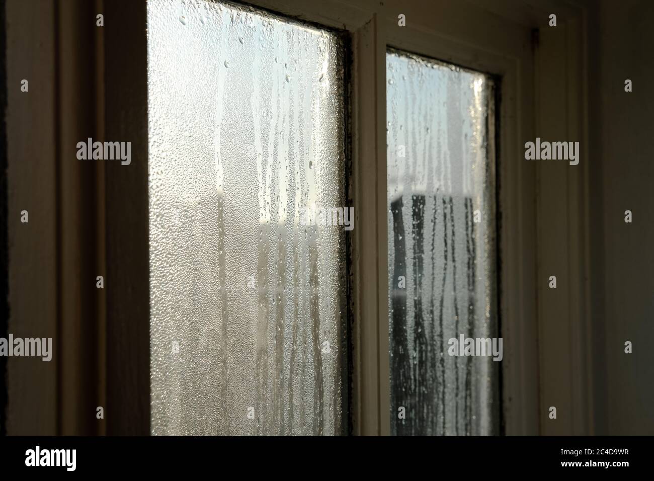 Interior of an old cottage, showing heavy water condensation on the ...