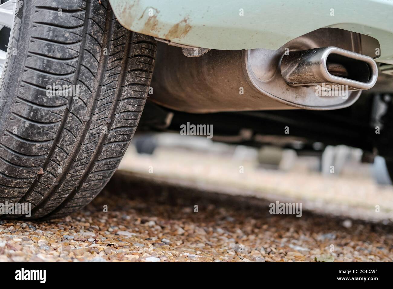 Ground level view of a new car, showing the rear tyre and tread ...
