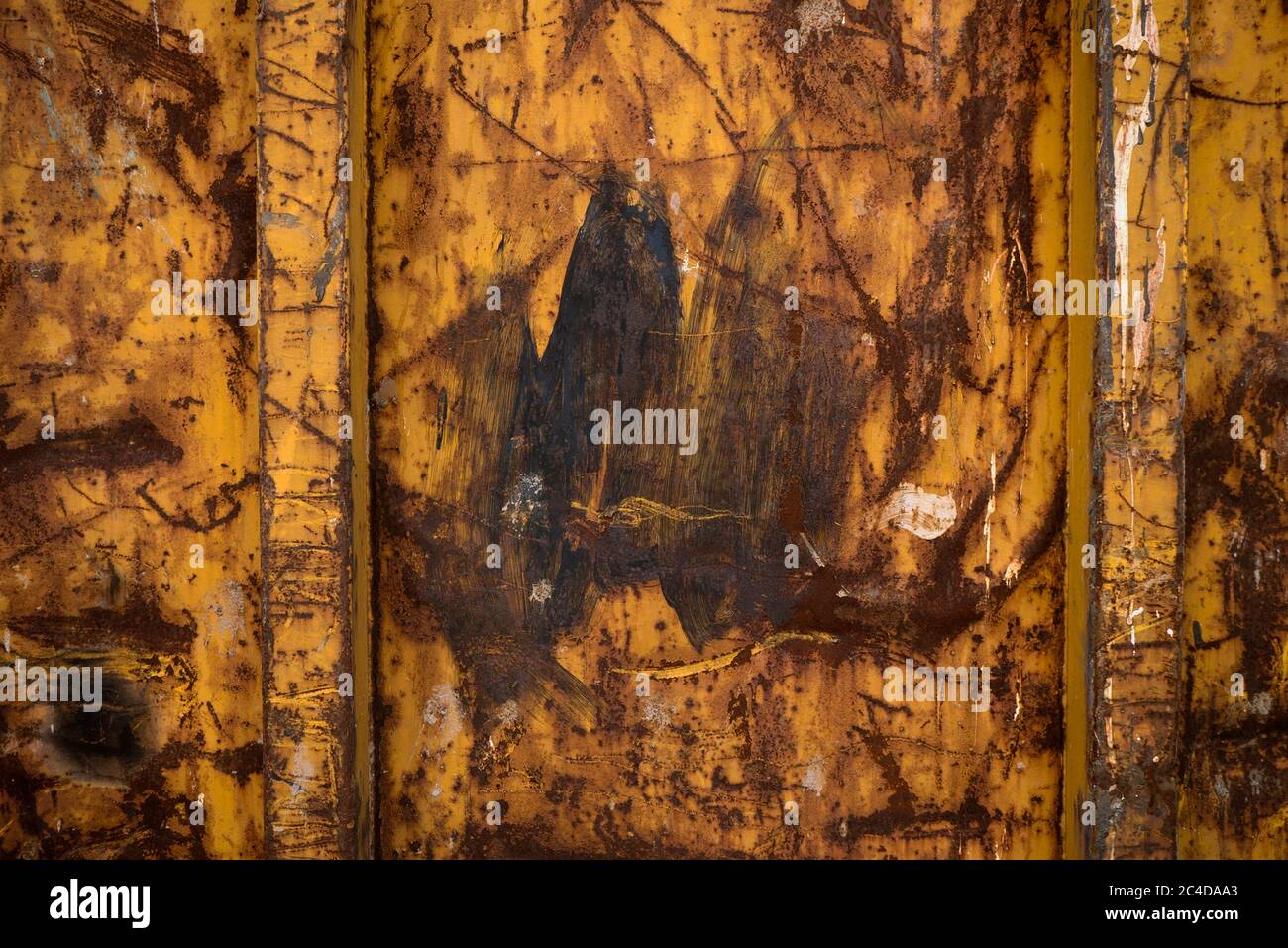 The Bashed And Worn Wall Of A Yellow Skip Stock Photo - Alamy