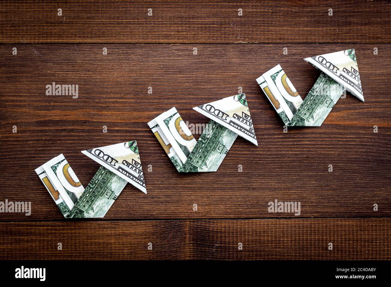 Arrow of dollar chart - currency trading concept Stock Photo - Alamy