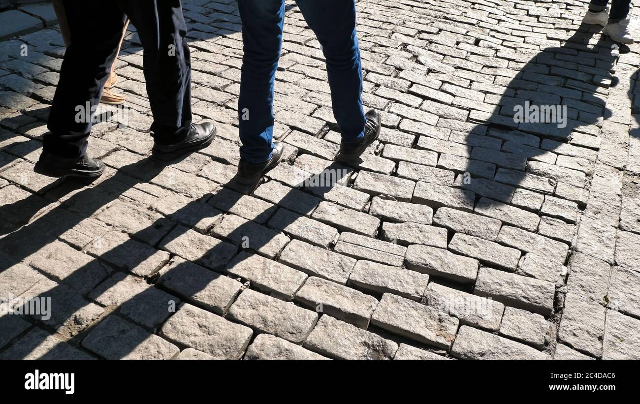 Paving slabs with a shadow from pedestrians on the street of Istanbul ...