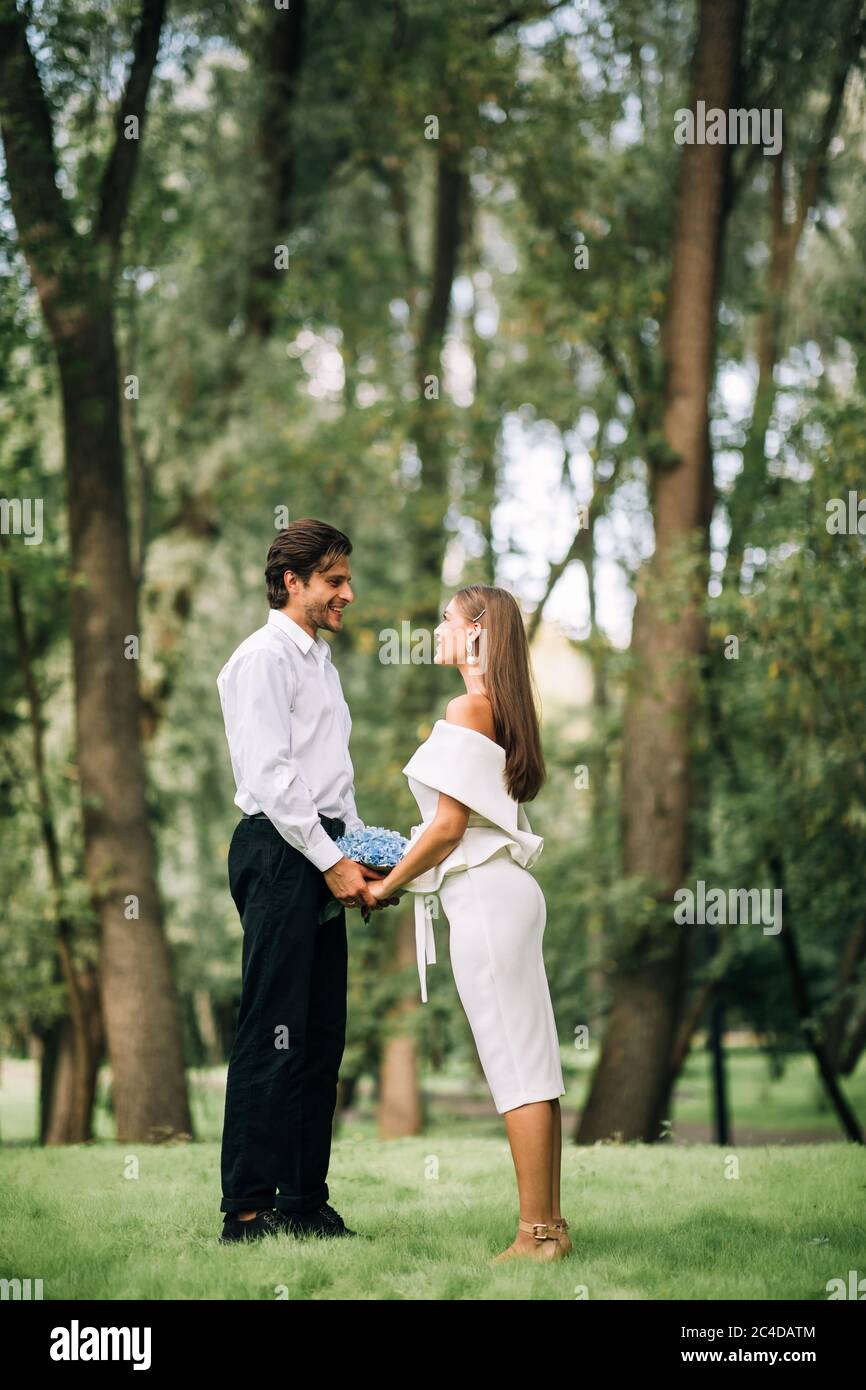 Wedding Couple Saying Marriage Vows During Ceremony In Park, Vertical ...