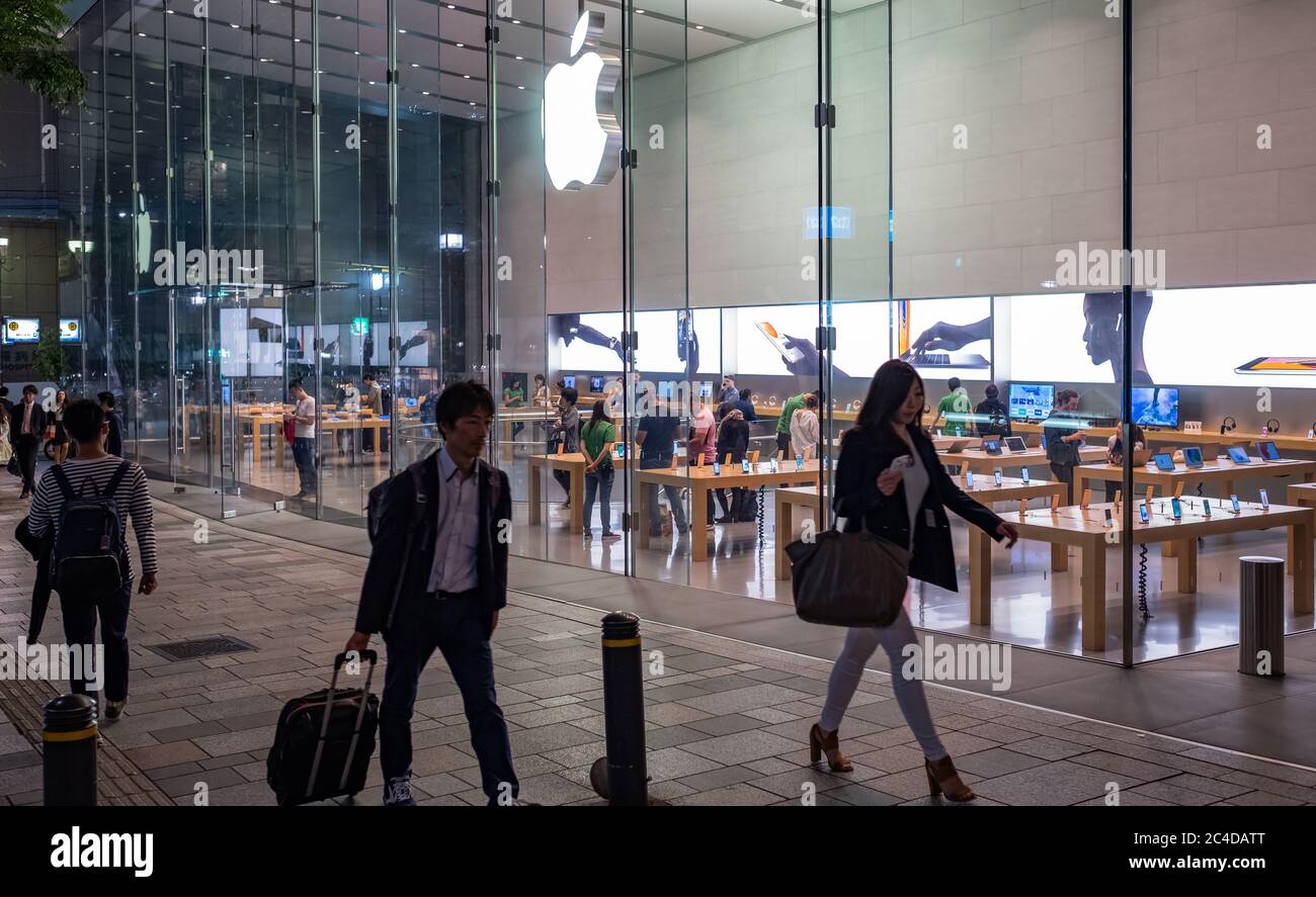 Apple store front in Omotesando Street at night, Tokyo, Japan Stock ...