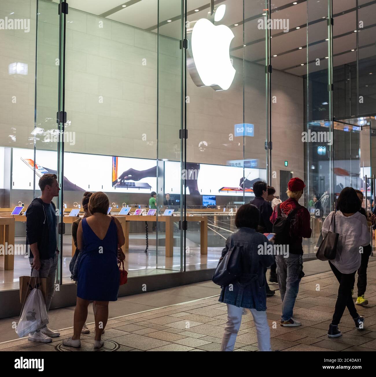 Apple store front in Omotesando Street at night, Tokyo, Japan Stock ...