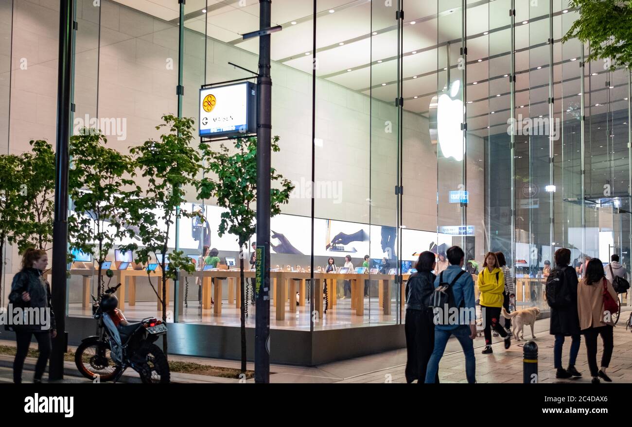 Apple store front in Omotesando Street at night, Tokyo, Japan Stock ...