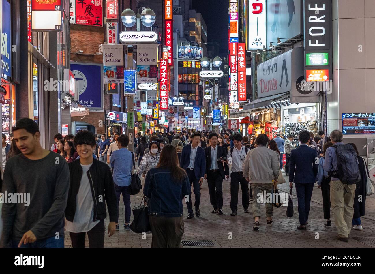 Pedestrian walking in Shibuya back alley street, at night, Tokyo, Japan ...