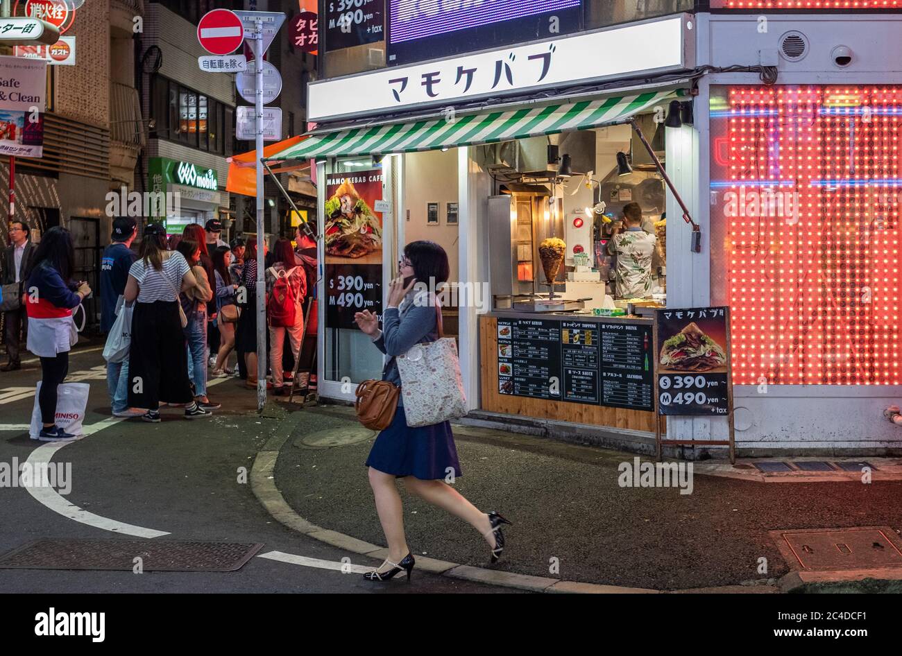 Pedestrian walking in Shibuya back alley street, at night, Tokyo, Japan ...