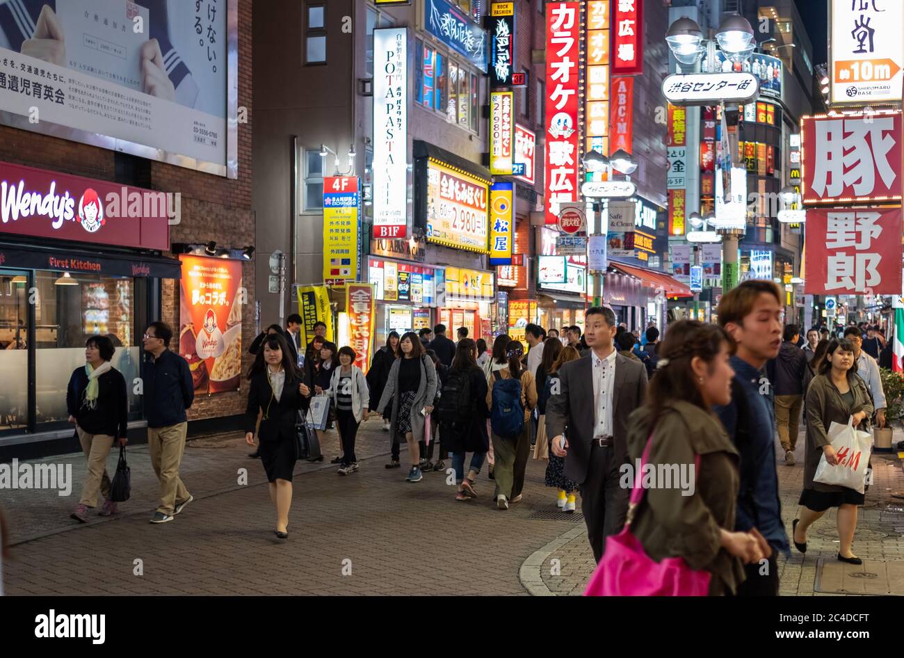 Pedestrian walking in Shibuya back alley street, at night, Tokyo, Japan ...