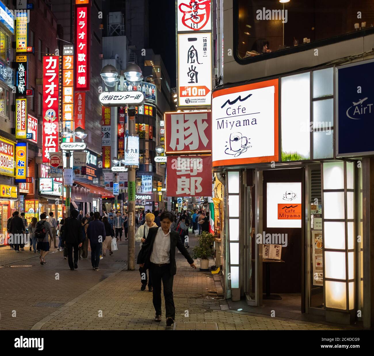 Pedestrian walking in Shibuya back alley street, at night, Tokyo, Japan ...