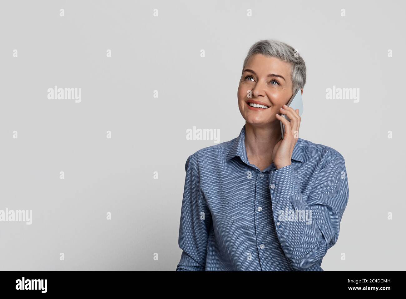 Modern Communication. Smiling Middle-Aged Businesswoman Talking On ...