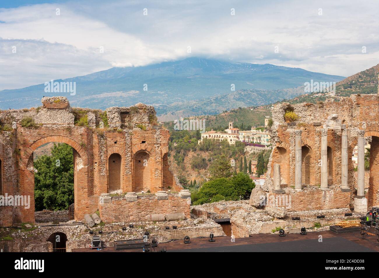 The ancient -roman-greek amphitheater with the Etna Volcano in the back ...