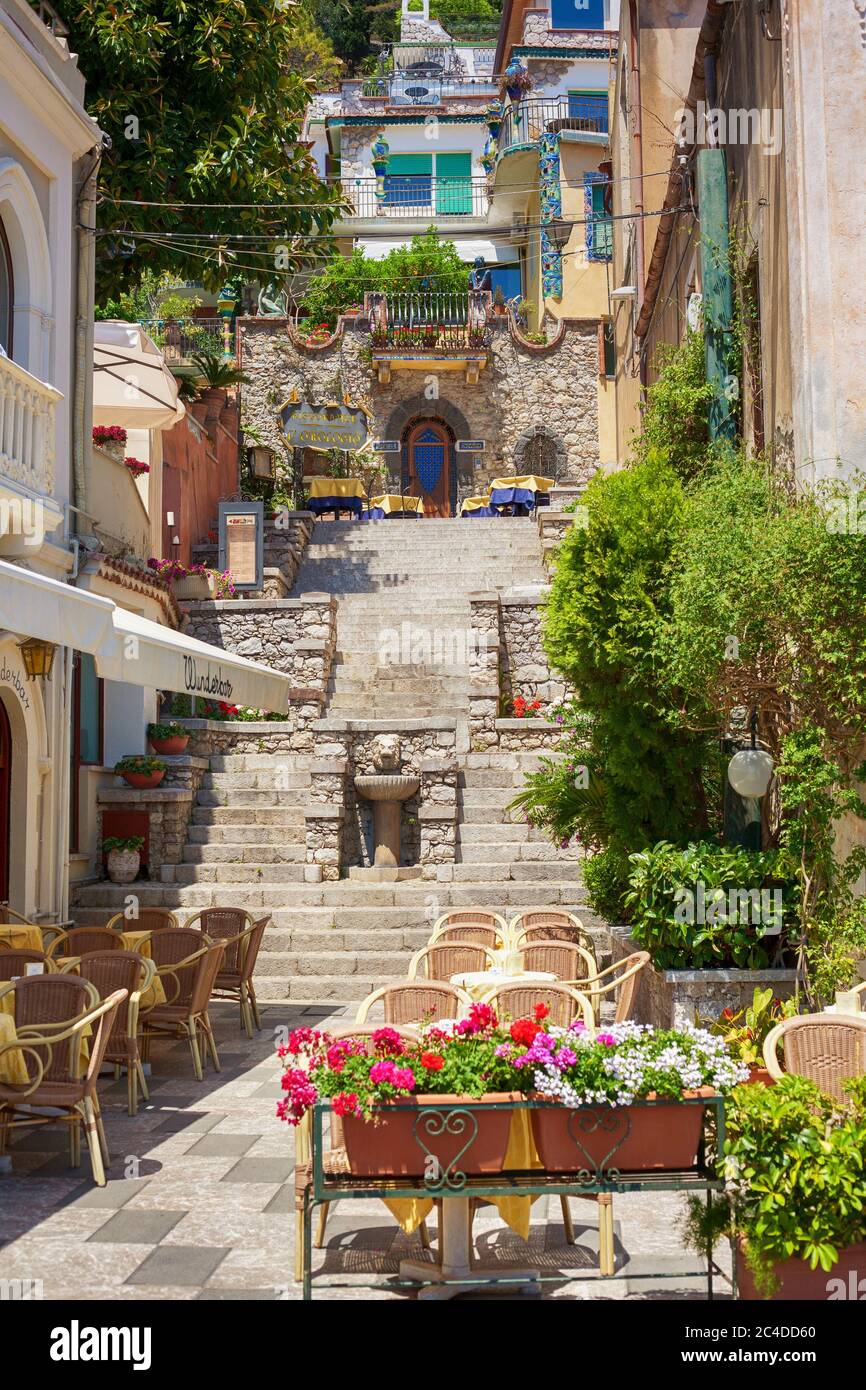 TAORMINA, SICILY - MAY 11, 2012: Restaurants with stone steps in ...
