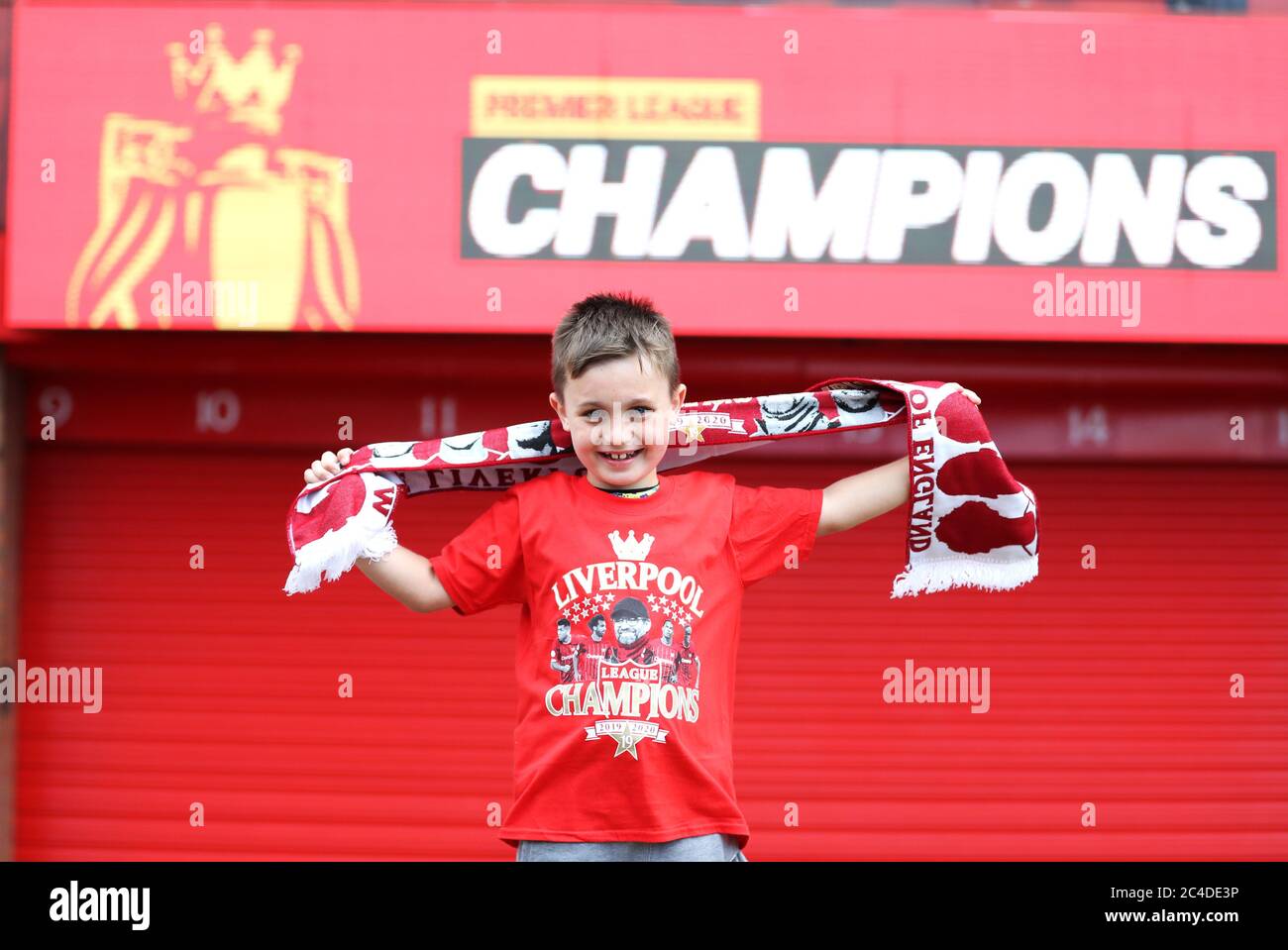 Tristan Rywacki, aged 7, poses for a photo outside Anfield in Liverpool ...